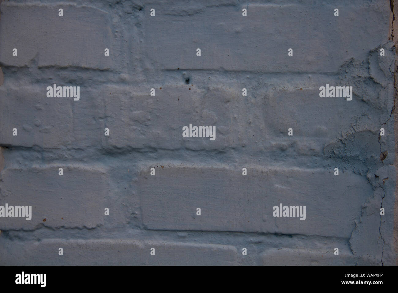 old wall. brick wall whitewashed in blue. Background Stock Photo - Alamy
