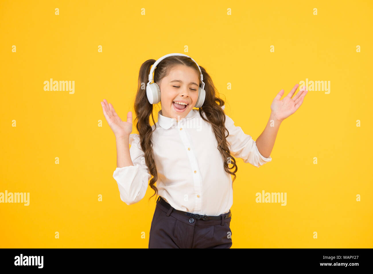 The song clicks with her mood. Adorable little girl singing a song on ...