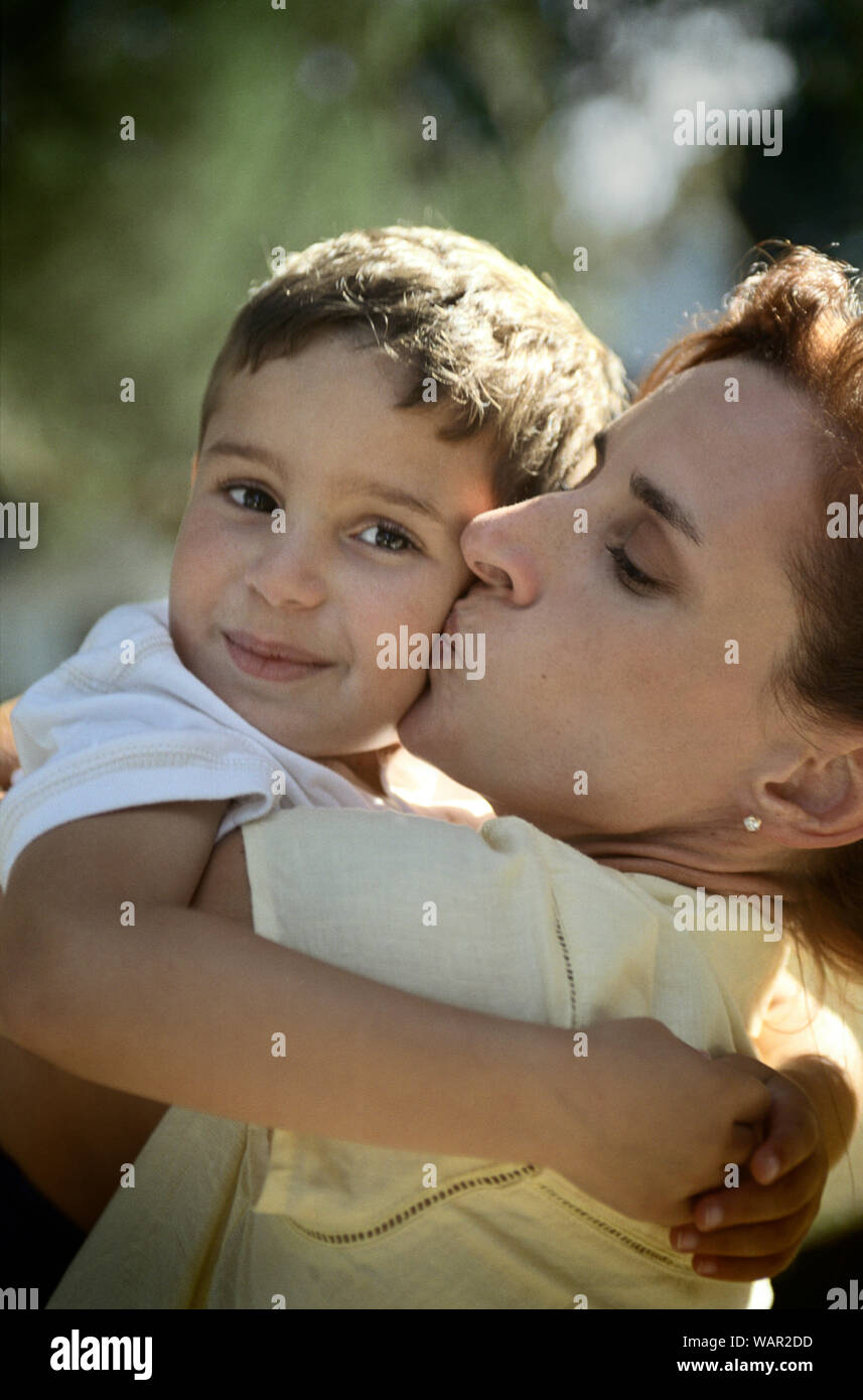 A mother comforting her small child Stock Photo - Alamy