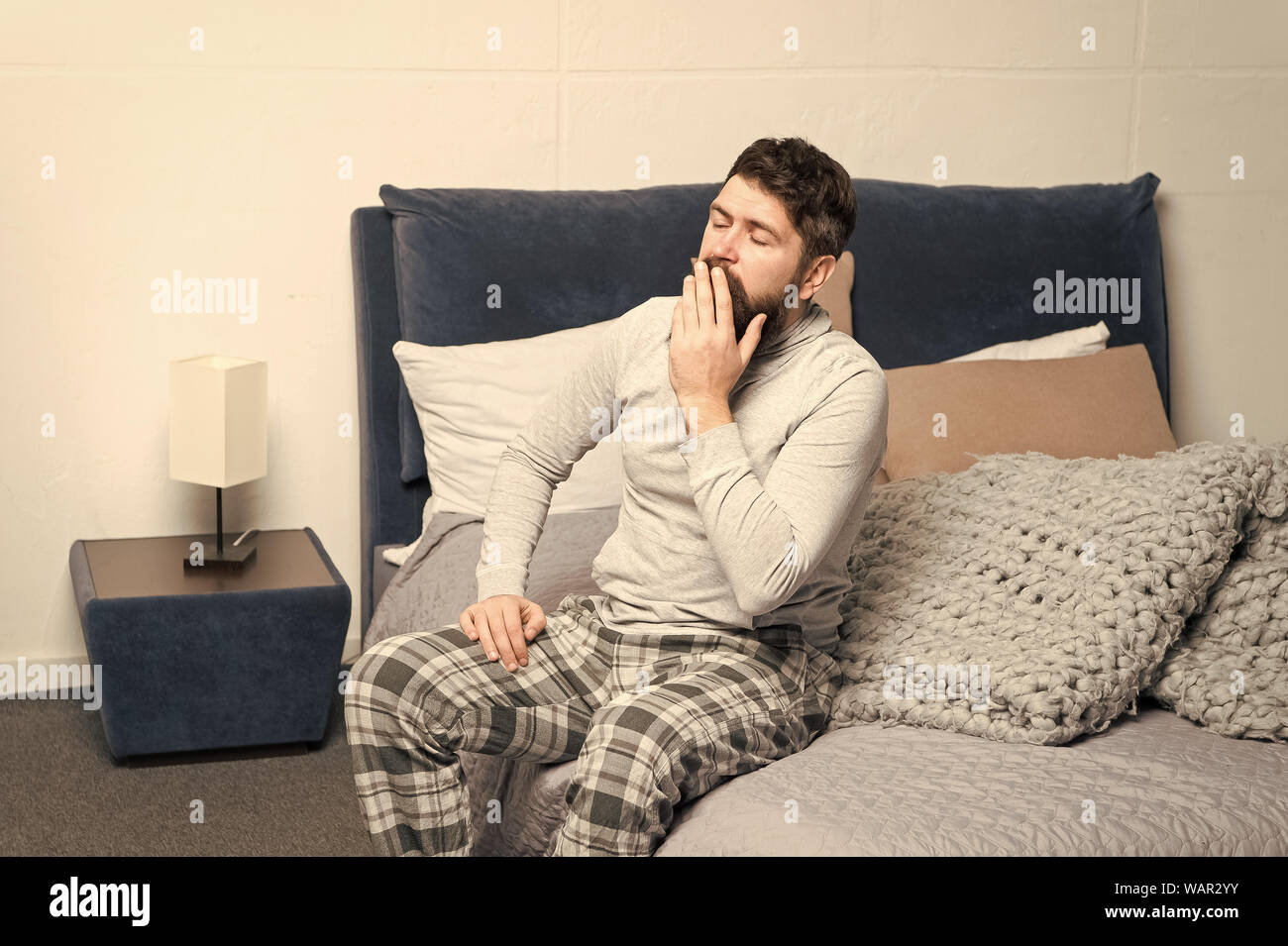 Get up early. Tips for waking up early. Man bearded hipster sleepy face ...