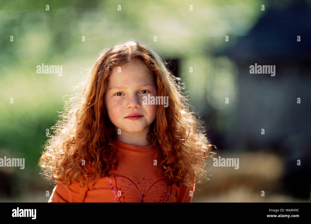 Portrait of little girl with red hair Stock Photo - Alamy