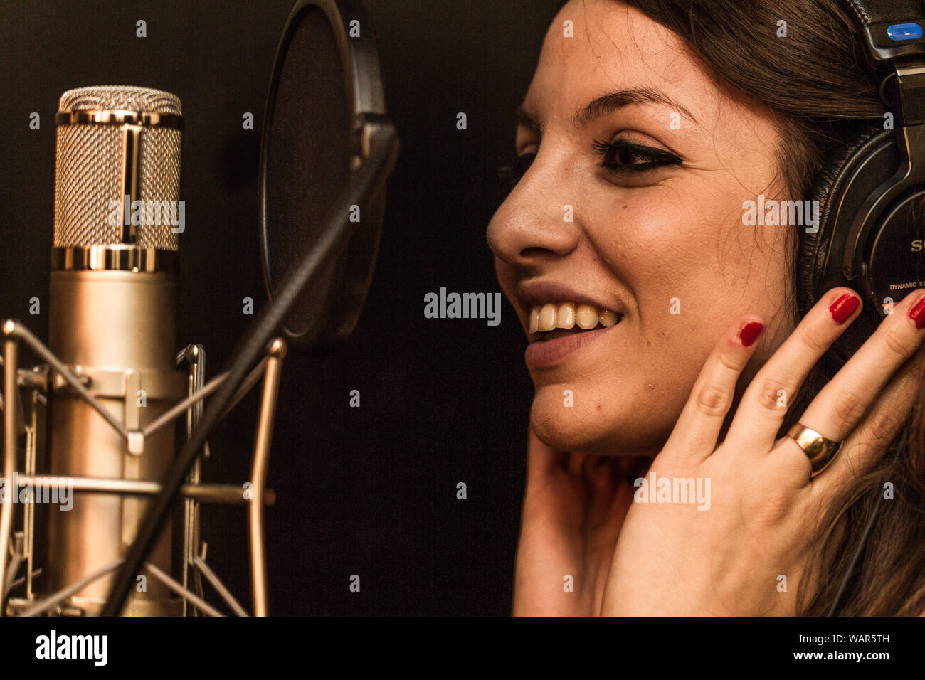 Female singer using radio microphone hi-res stock photography and ...