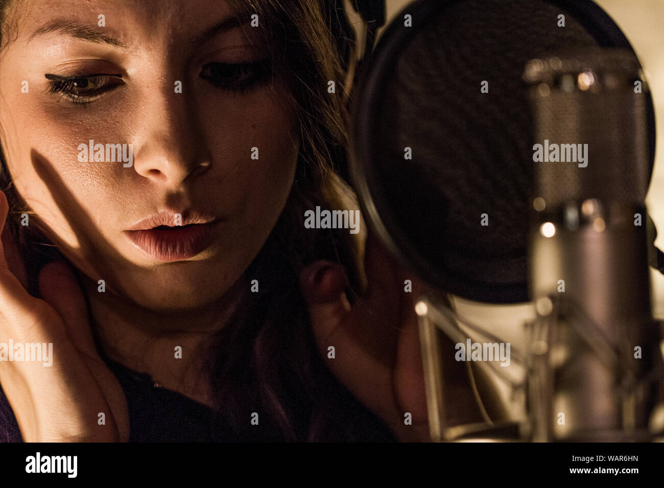 Female singer using radio microphone hi-res stock photography and ...