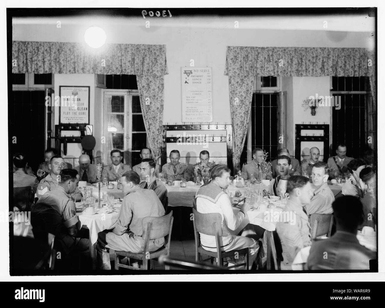 Dinner party at 'Y' hostel on June 7, '44. Gen. McConnell, etc Stock ...