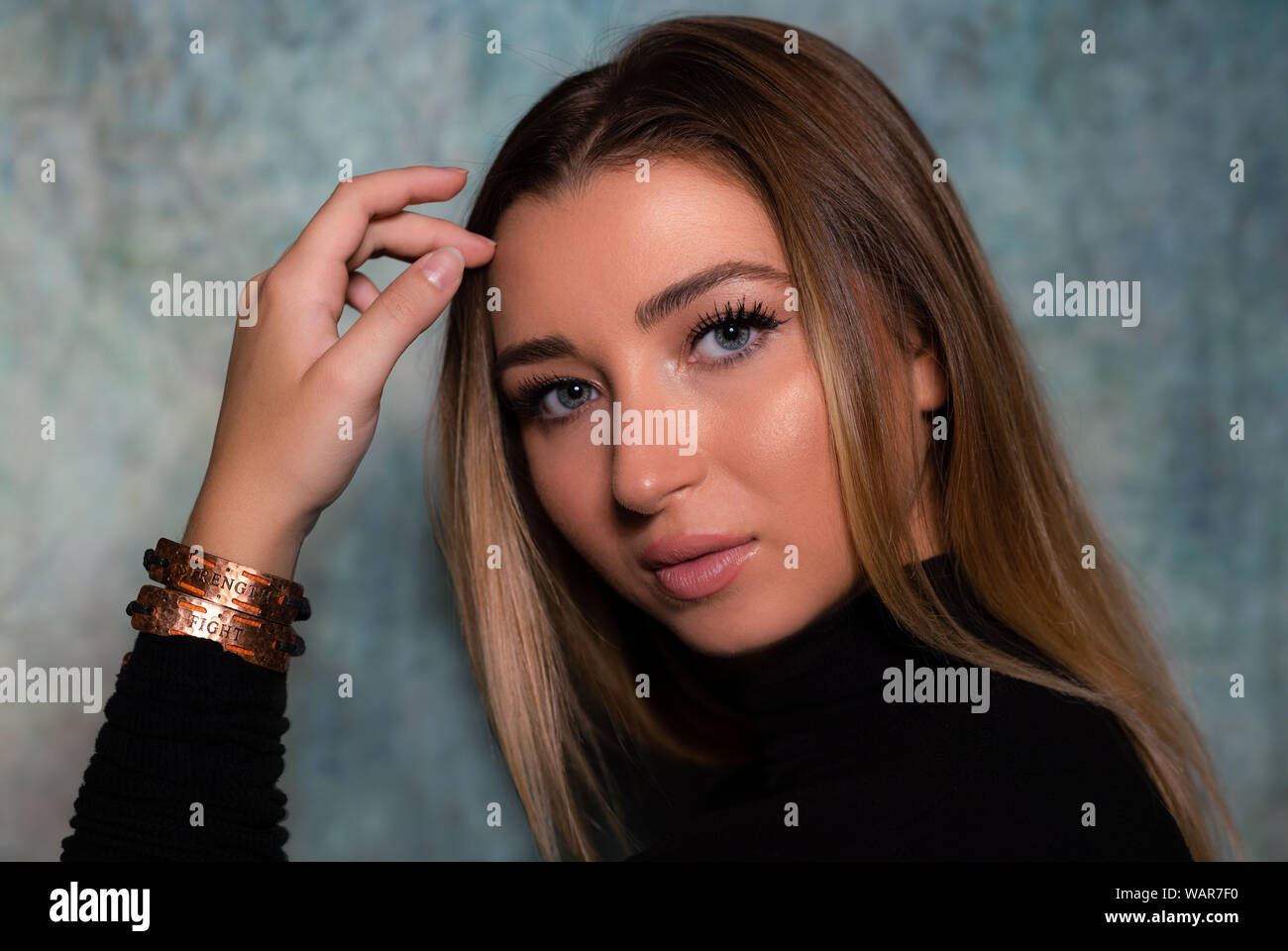 Portrait of a woman modeling bracelets Stock Photo - Alamy