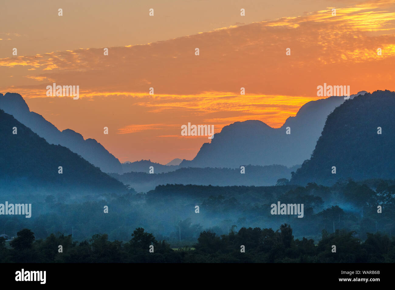 Asia,Southeast Asia, Laos, Vang Vieng , sunrise over karst mountains ...