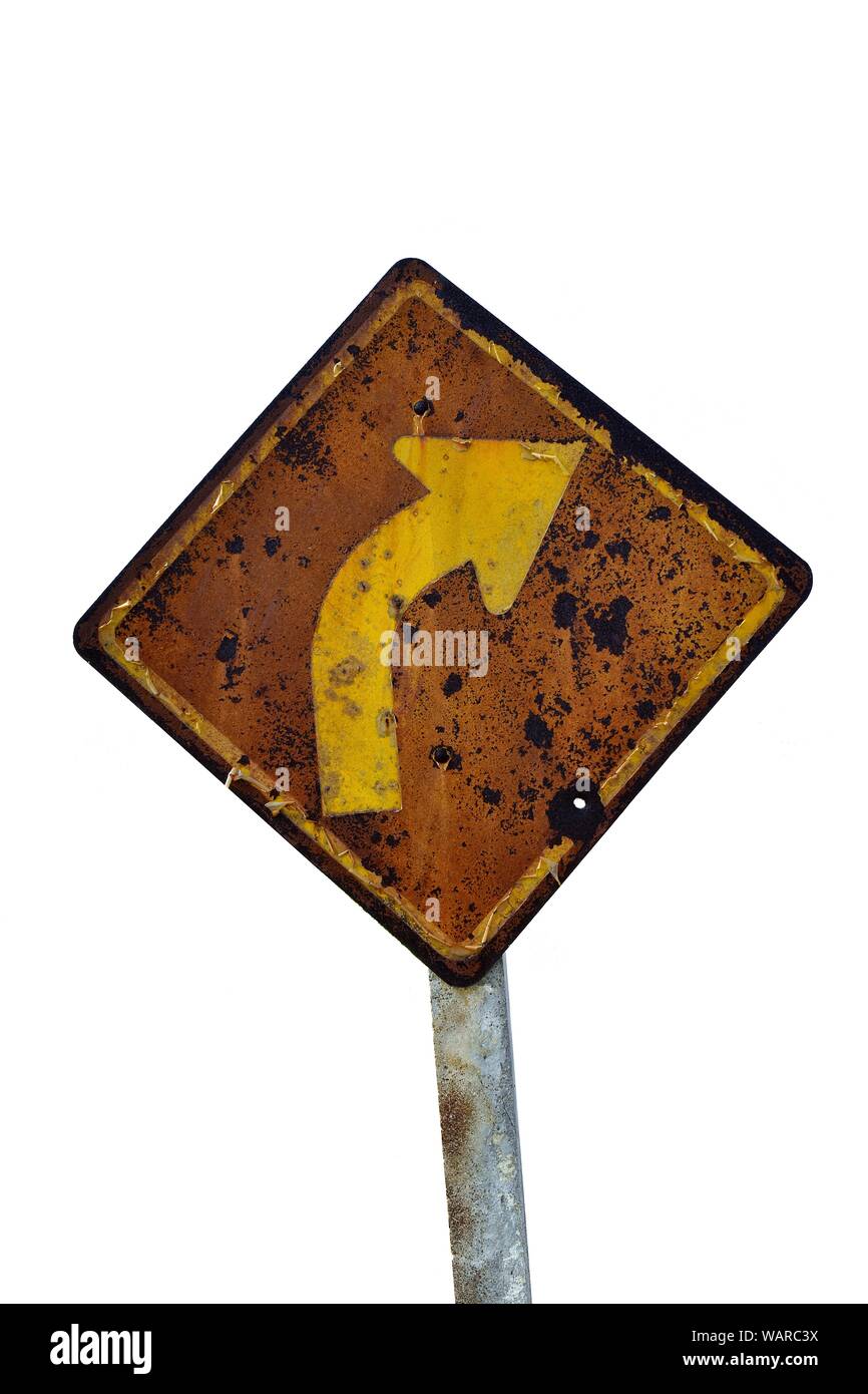 Very old rusty sheet metal sign,Curved road traffic sign isolated on ...
