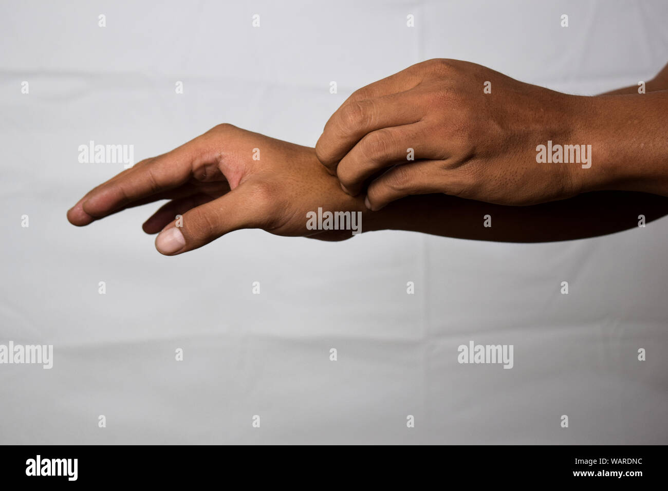 Close up Asian man scratch the itch with hand isolated on white ...