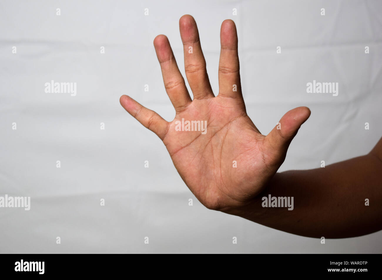 Close up Asian man shows hand gestures it means Hold Off isolated on ...