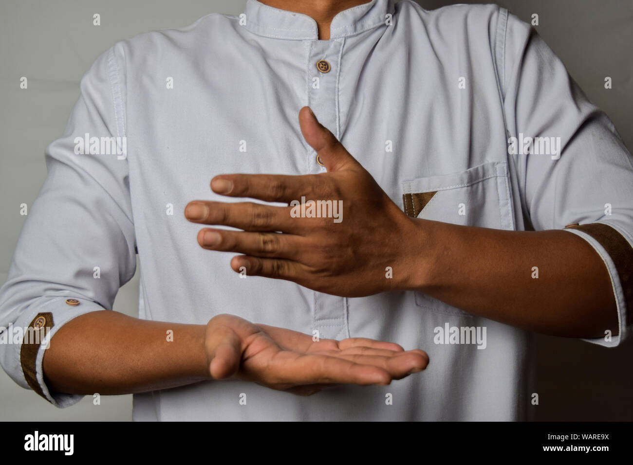 Close up Asian man shows hand gestures it means human emotion and ...