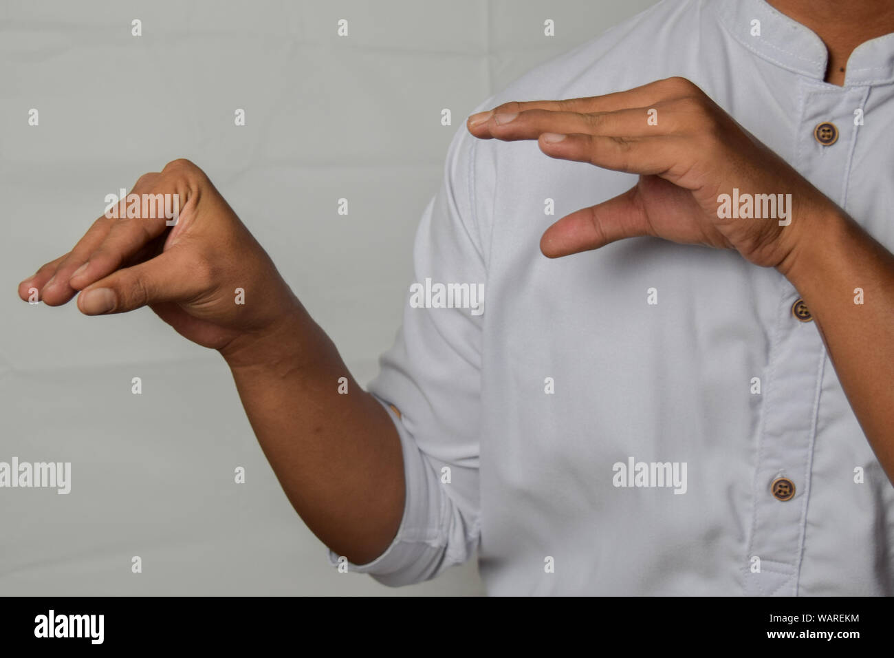 Close up Asian man shows hand gestures it means NO isolated on white ...
