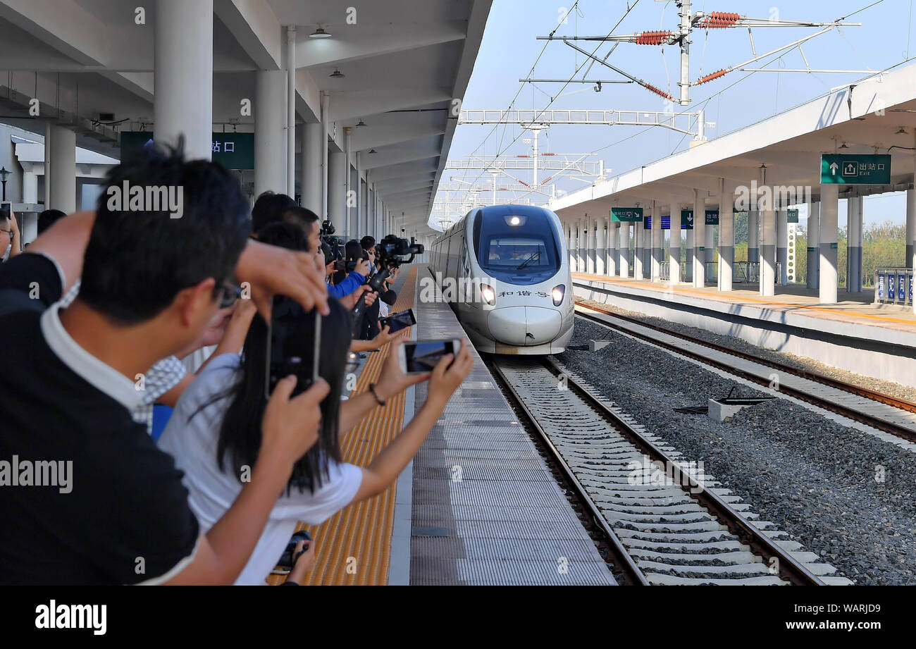 Beijing, China's Hebei Province. 21st Aug, 2019. People takes photos as ...