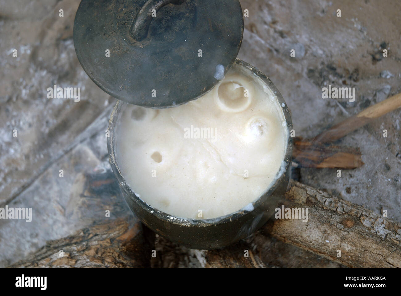 A pot of Nshima, a thick porridge made from finely ground corn meal ...