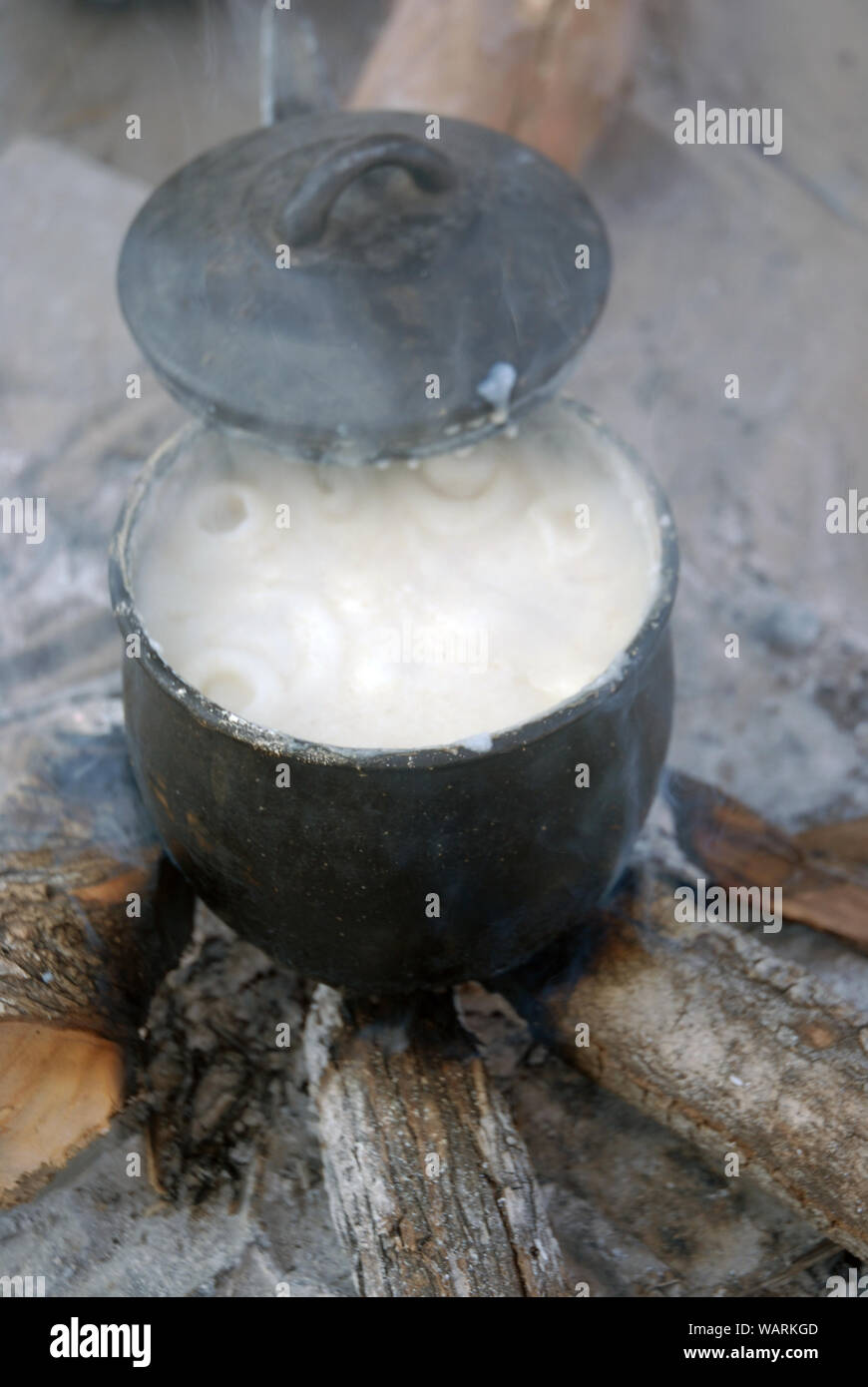 A pot of Nshima, a thick porridge made from finely ground corn meal ...