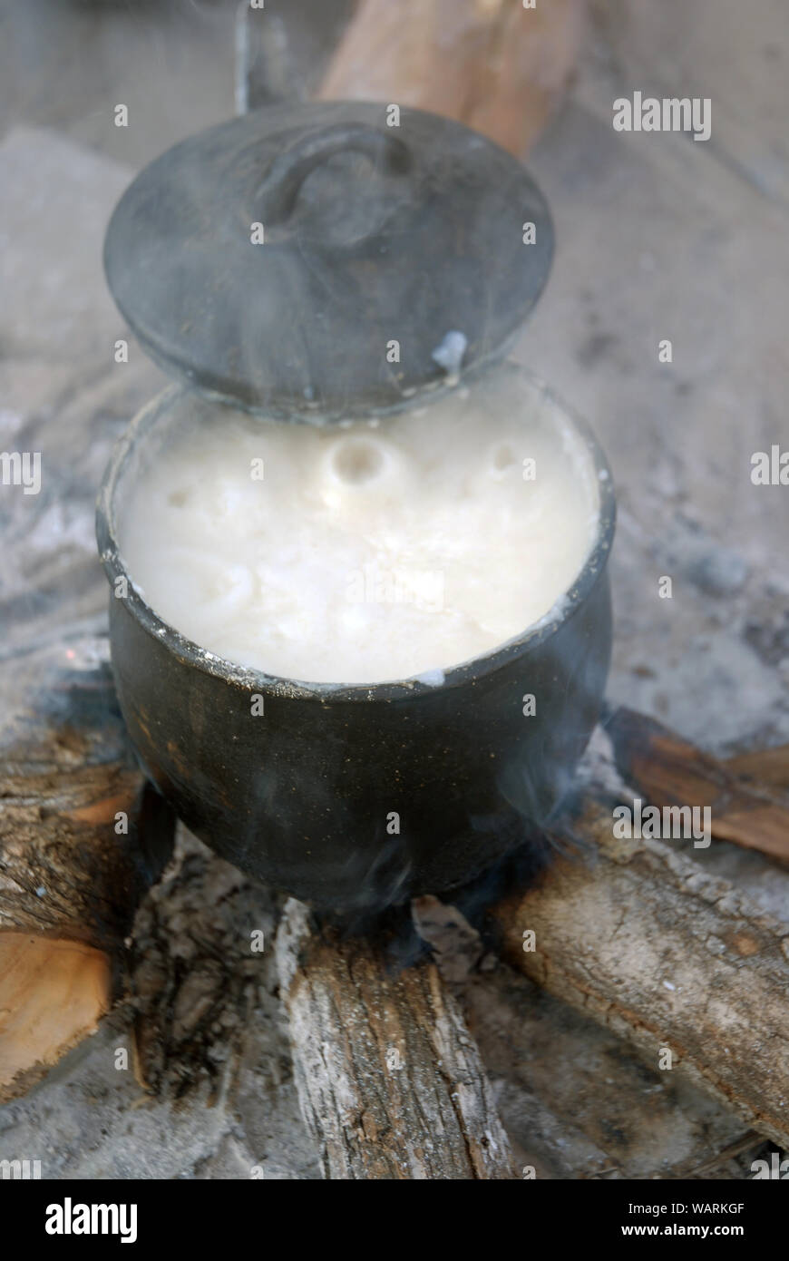 A pot of Nshima, a thick porridge made from finely ground corn meal ...