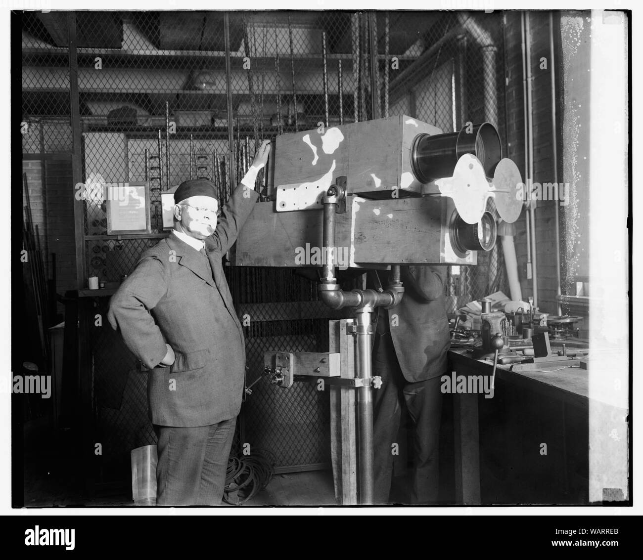 Dr. George H. Peters with camera to photograph eclipse, 1/6/25 Stock ...