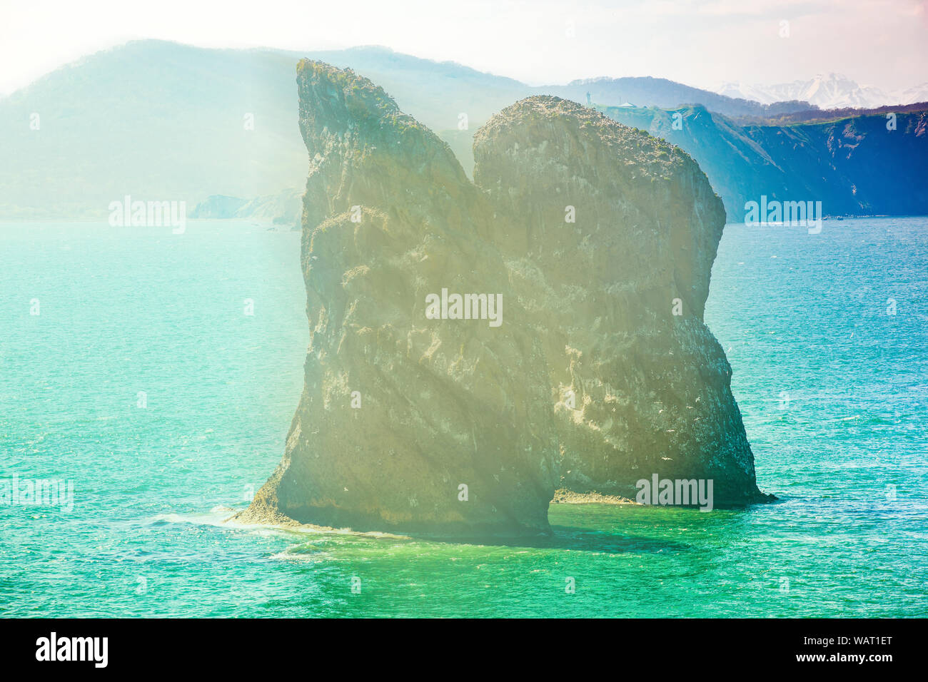 high rocks in the sun on the sea Stock Photo - Alamy