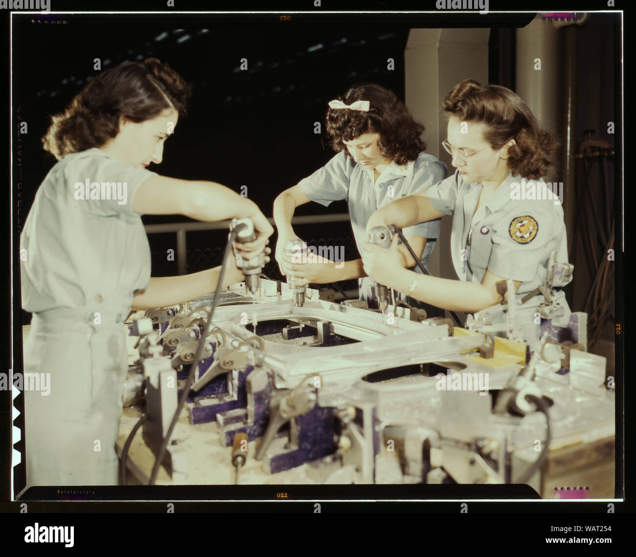 Drilling a wing bulkhead for a transport plane at the Consolidated ...