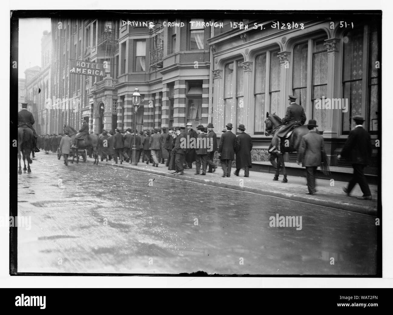 Driving crowd through 15th St., New York Stock Photo - Alamy