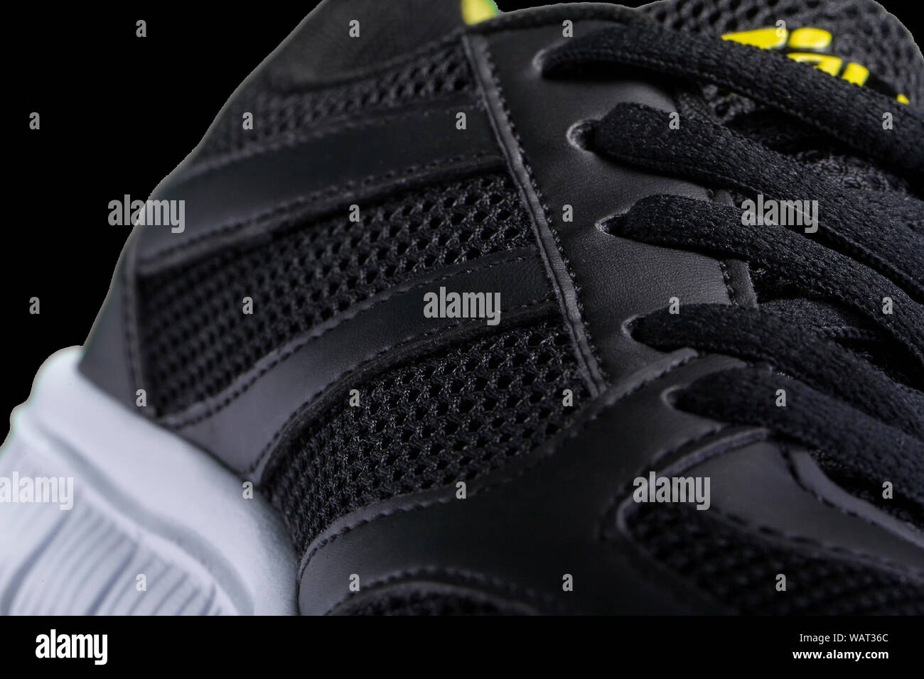 Fragment of a black sneaker with white sole close up. Sneaker texture ...