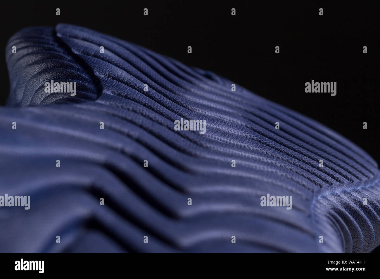 Fragment of a blue sole of a sneaker. The texture of the material of ...