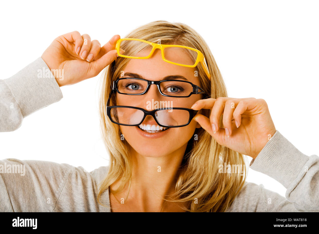 Woman trying on three examples of glasses, isolated on white background ...
