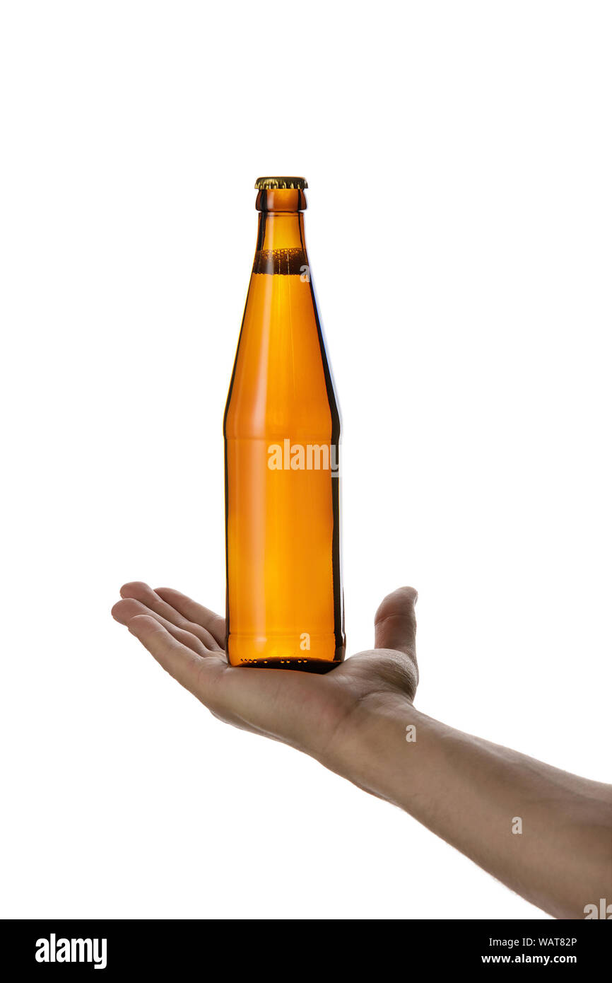 male hand holding brown beer bottle without label isolated on white ...