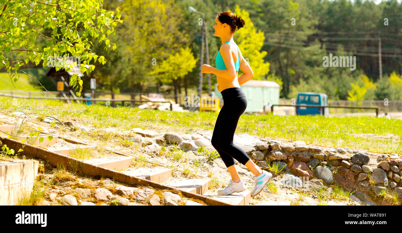 Young woman running on stairs outside in summer day. Challenge for ...