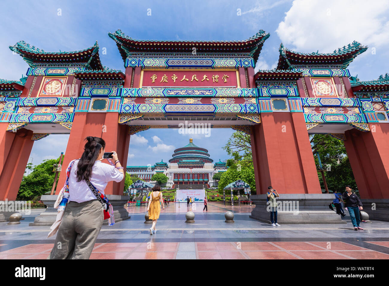 Crowds of people visiting the Great Hall of Chongqing people's Square ...