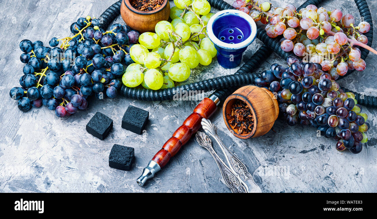 Tobacco shisha with grapes flavor.Nargile with grapes.Turkish fruit hookah tobacco Stock Photo ...