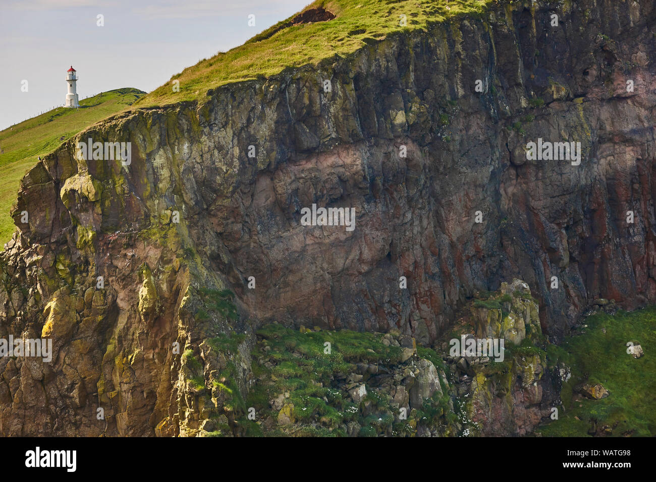 Mykines lighthouse and cliffs on Faroe islands. Hiking landmark ...