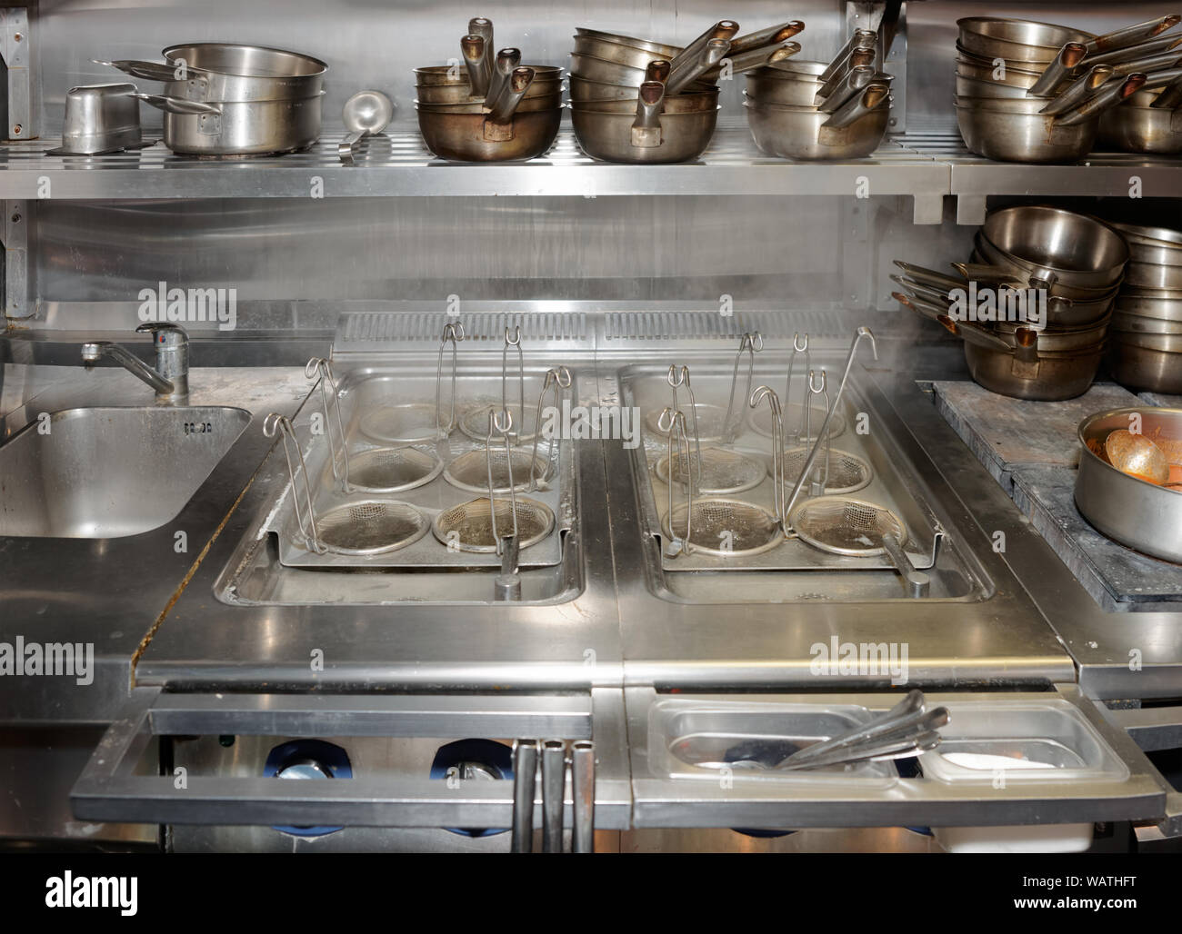Typical kitchen of a restaurant shot in operation Stock Photo - Alamy