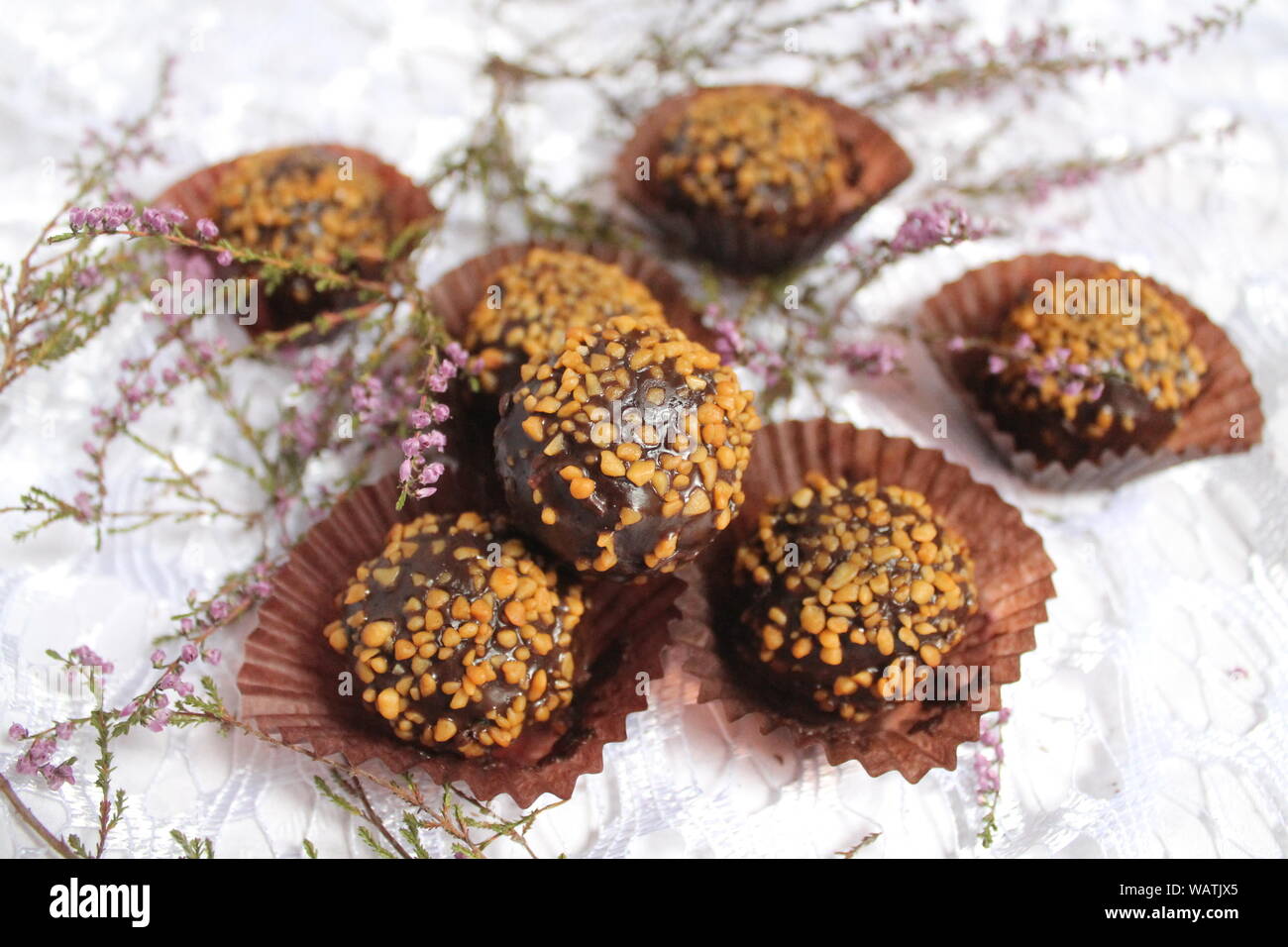 appetizing sweet chocolate candy with nut on top for dessert Stock ...