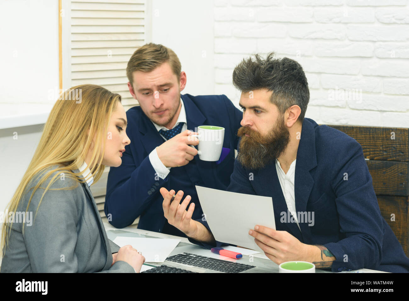 Business partners or businessmen at meeting, office background ...