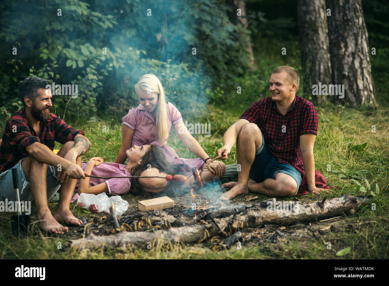 Group Of Friends Camping In Woods Smiling People Talking Around group-of-friends-camping-in-woods-smiling-people-talking-around