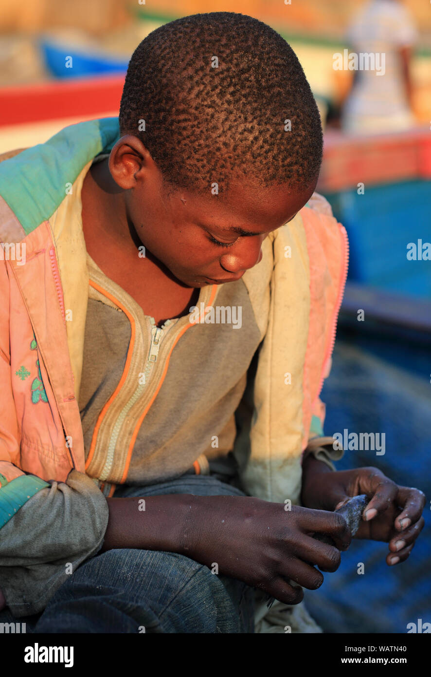 Colorful fishing boats and fisherman at the beach of Cape Maclear ...