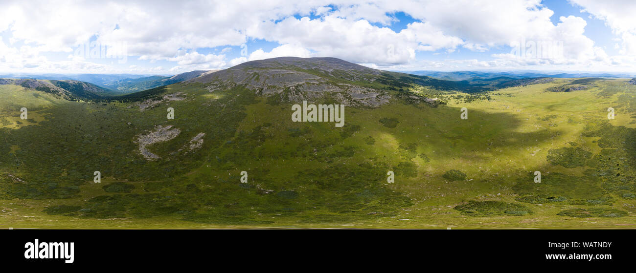 360 degree panoramic aerial view in the wild with green fields and ...