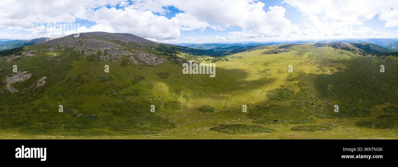 360 degree panoramic aerial view in the wild with green fields and ...