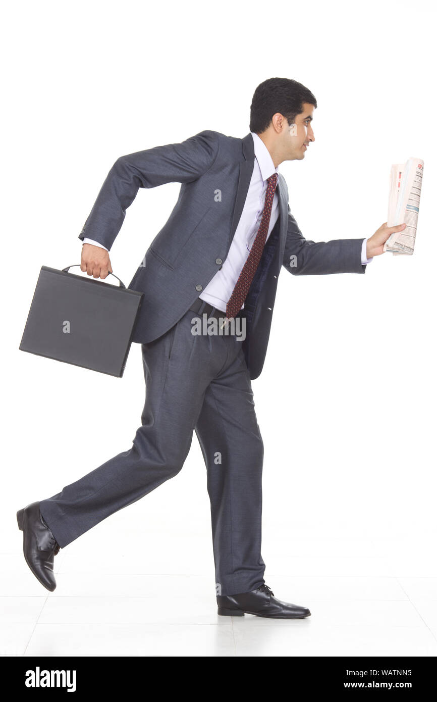 Indian businessman running hi-res stock photography and images - Alamy