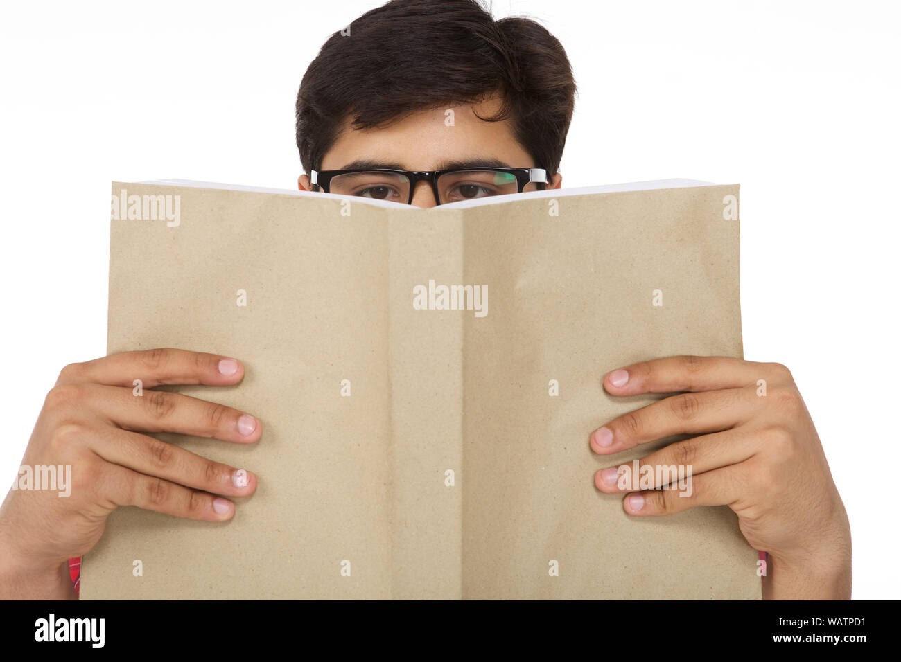 College student reading a book Stock Photo - Alamy