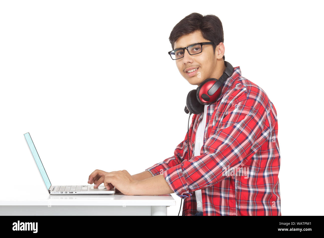 College student using a laptop and smiling Stock Photo - Alamy