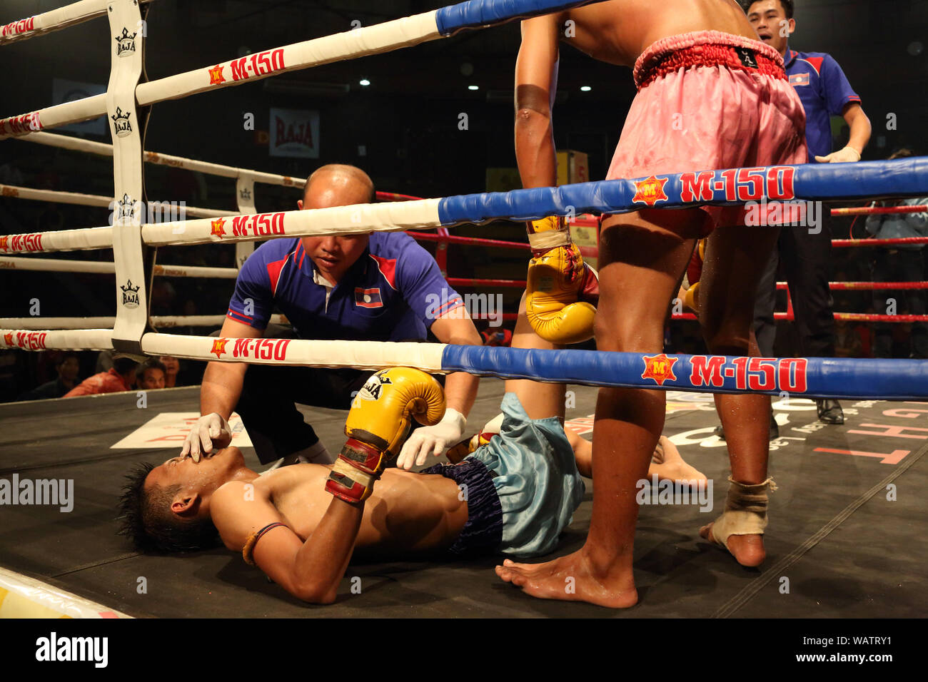 Traditional Muay Lao boxer at a kick boxing tournament in Vientianne, Laos Stock Photo - Alamy
