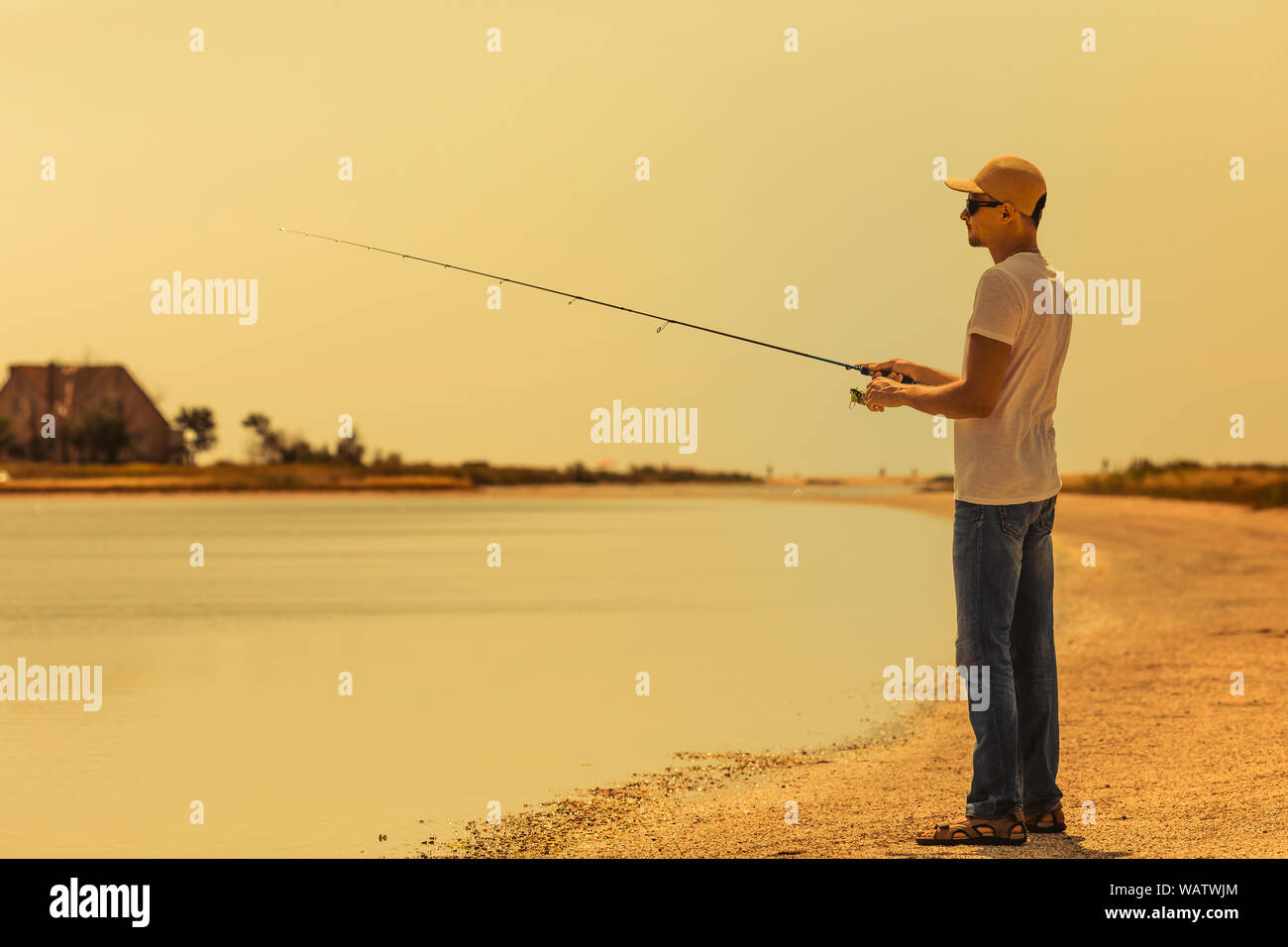 Fisherman uses spinning reel catch hi-res stock photography and images ...