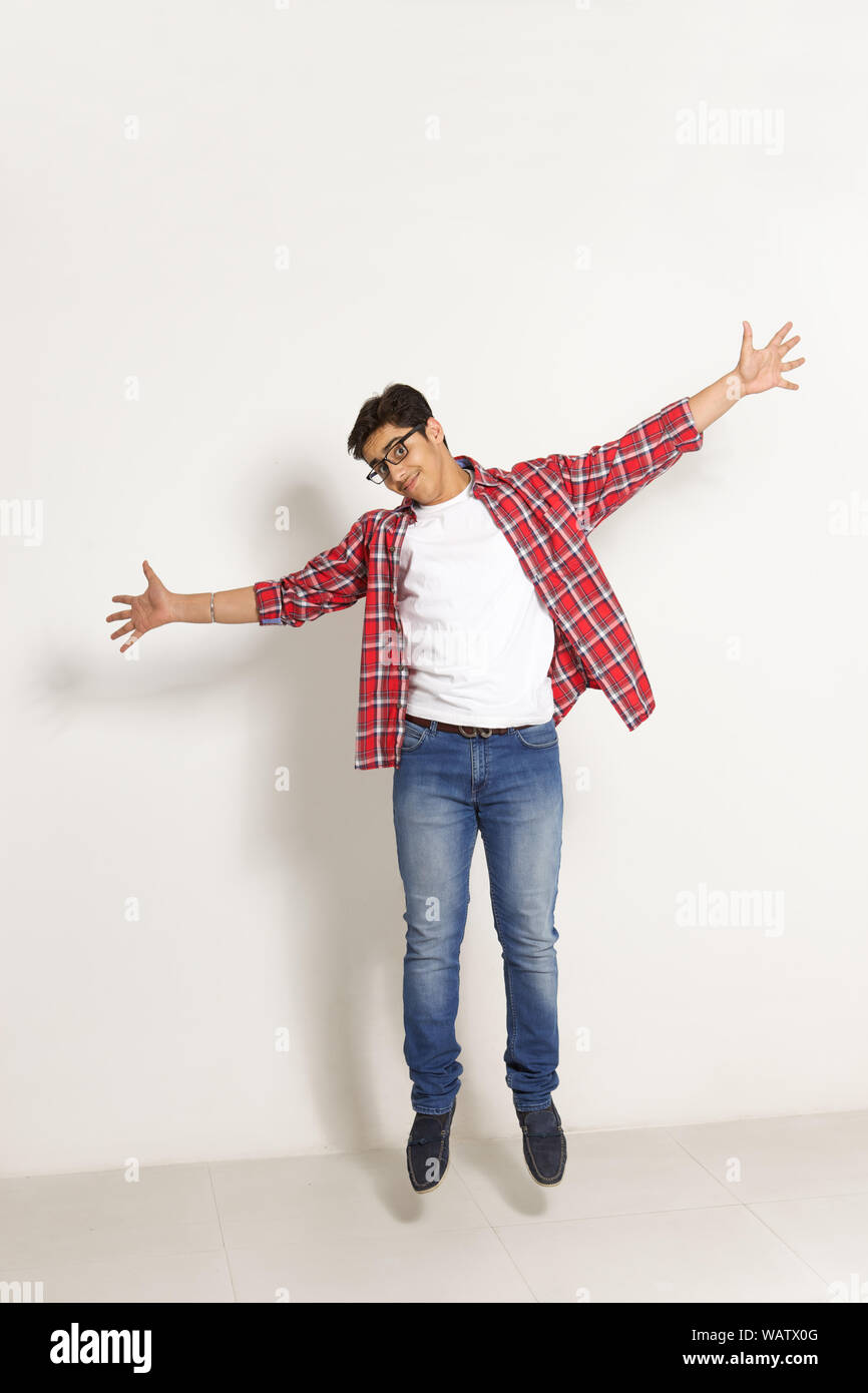 College student jumping in mid air Stock Photo - Alamy