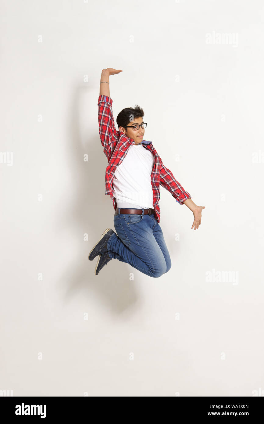 College student jumping in mid air Stock Photo - Alamy