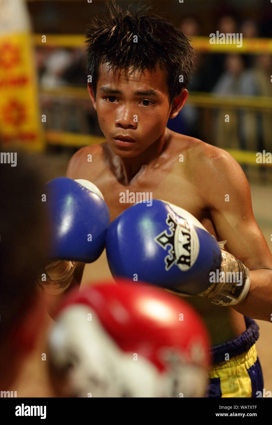 Traditional Muay Lao boxer at a kick boxing tournament in Vientianne ...
