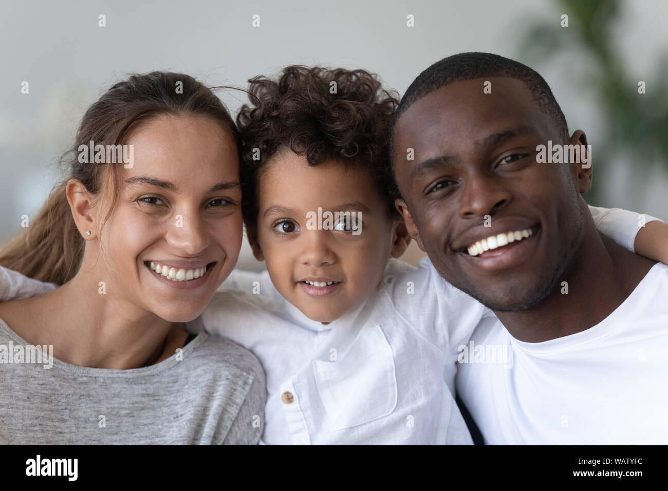 Happy mixed ethnicity family with cute kid son bonding, portrait Stock ...