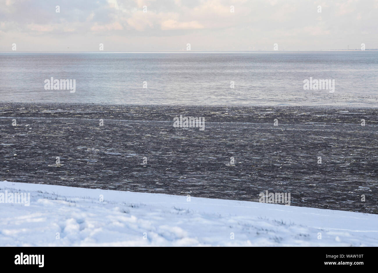 Different layers of grey in snow, ice, water and sky Stock Photo - Alamy