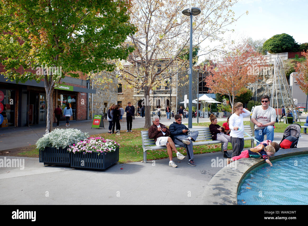 CHILDREN PLAYING NEAR WATER FEATURE Stock Photo - Alamy