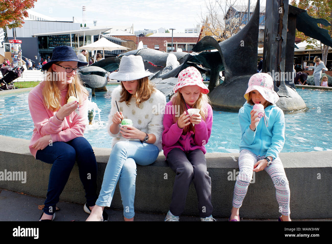 People Sitting By Water Feature High Resolution Stock Photography and ...